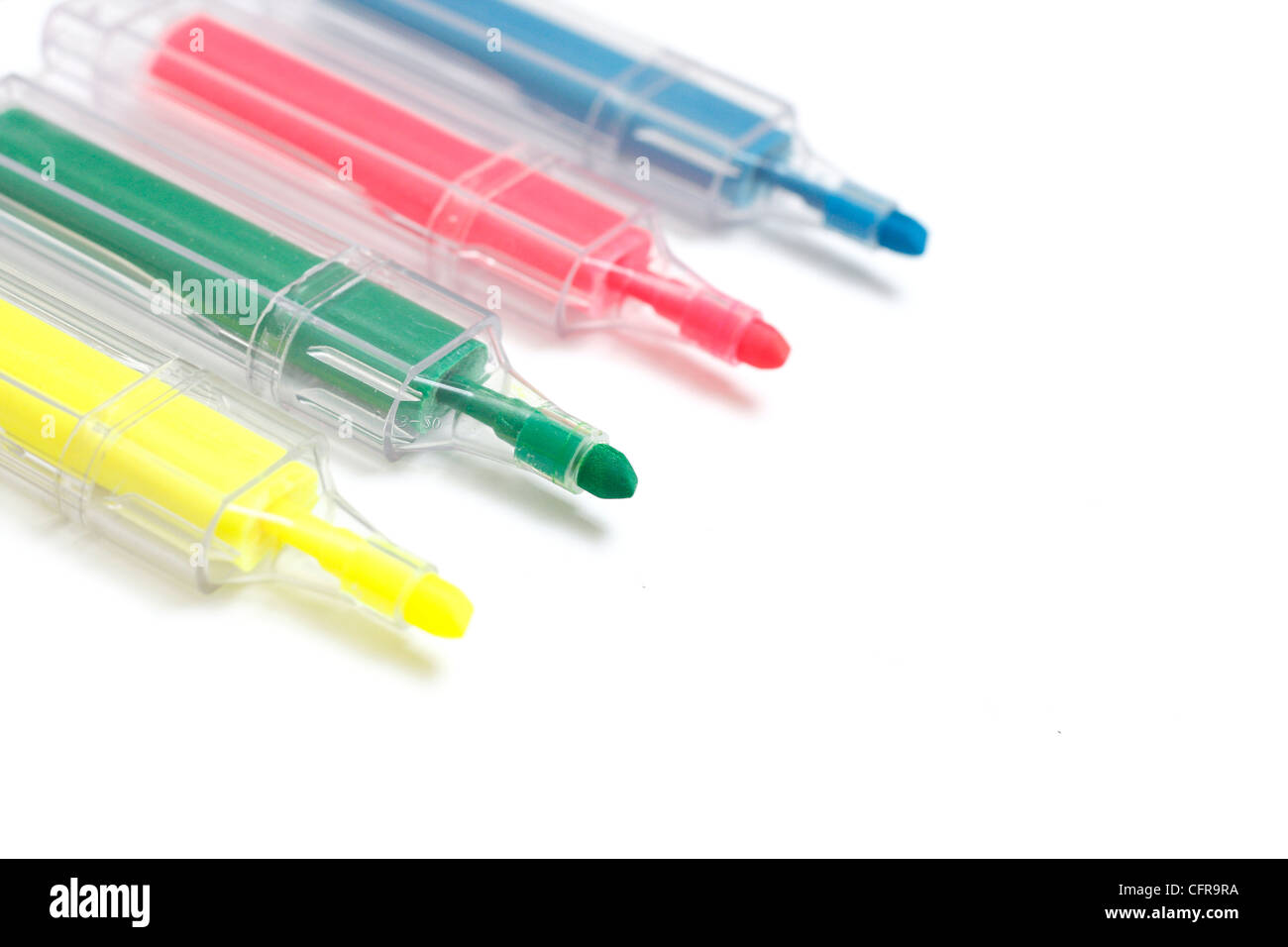 Four markers on a white background Stock Photo - Alamy