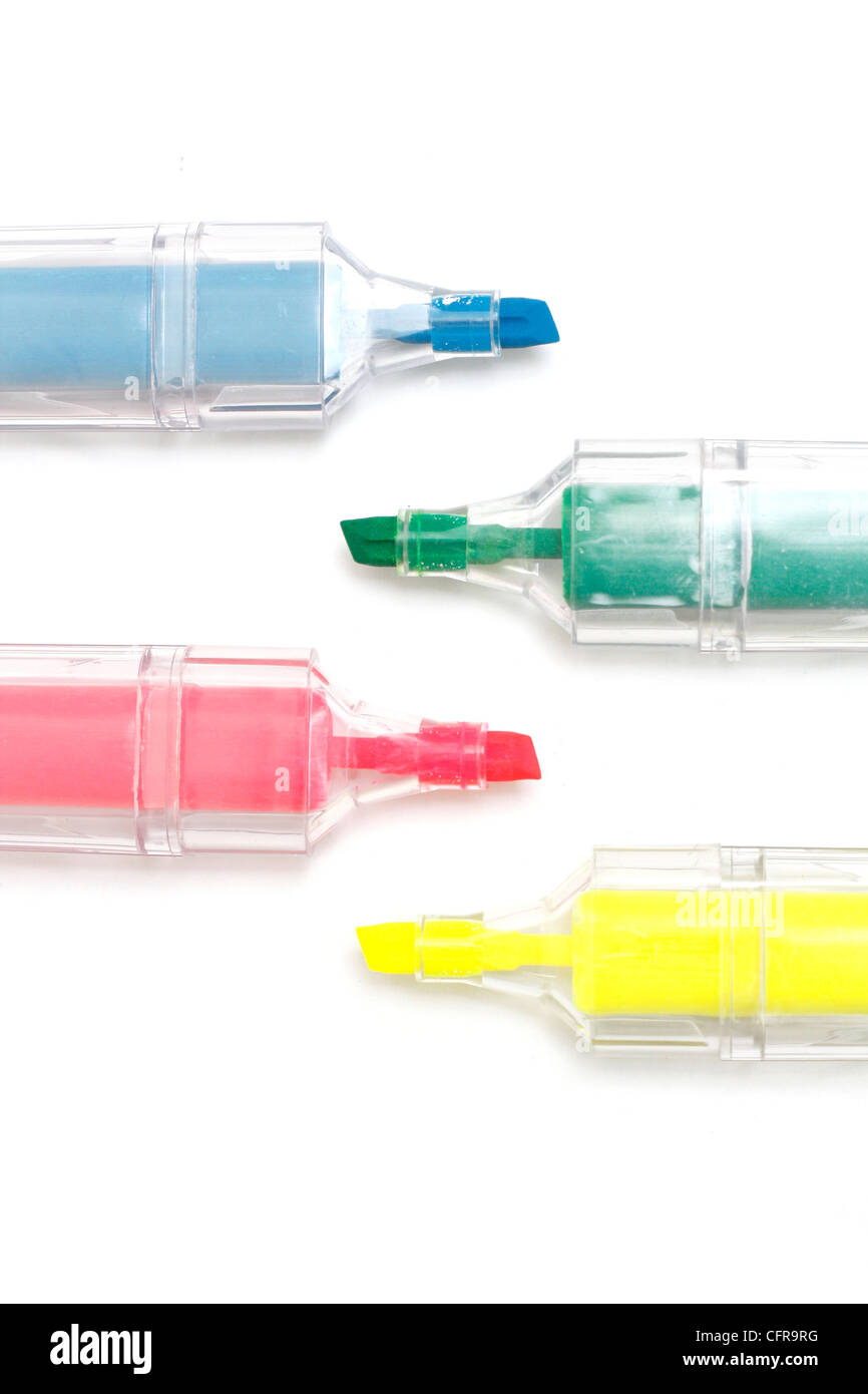 Four markers on a white background Stock Photo - Alamy