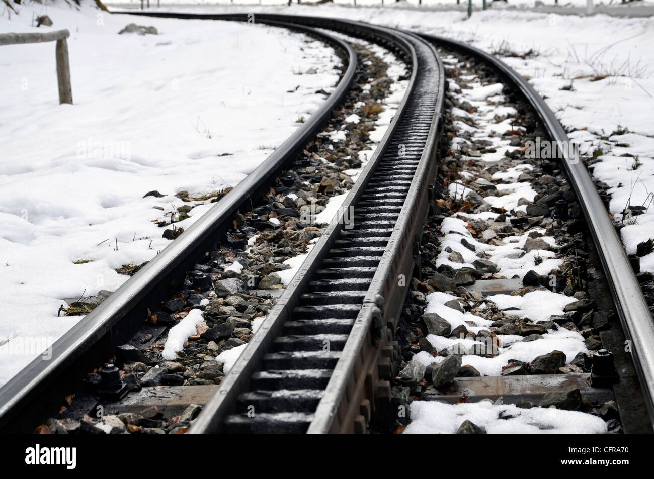 Tracks of a cog railway in the snow. This type of railway can climb ...