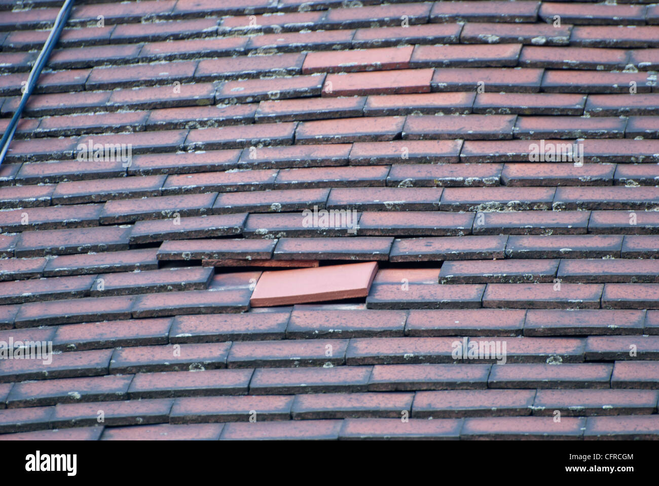 Slipped roof tiles hi-res stock photography and images - Alamy