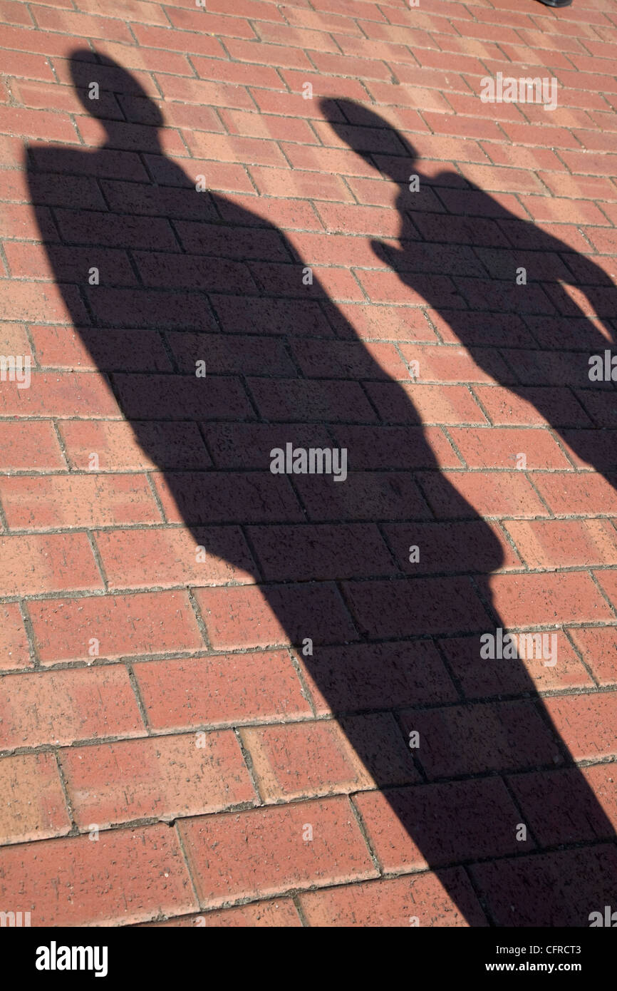 Male and Female Shadows on Pavement Stock Photo - Alamy