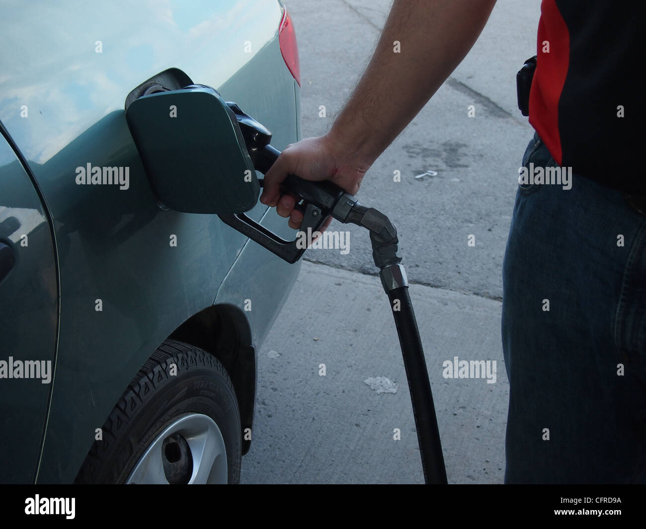 Man putting gas in car hi-res stock photography and images - Alamy