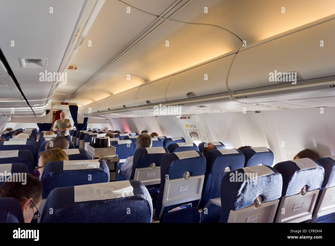 airline steward serving inflight drinks during an SAS airline flight ...