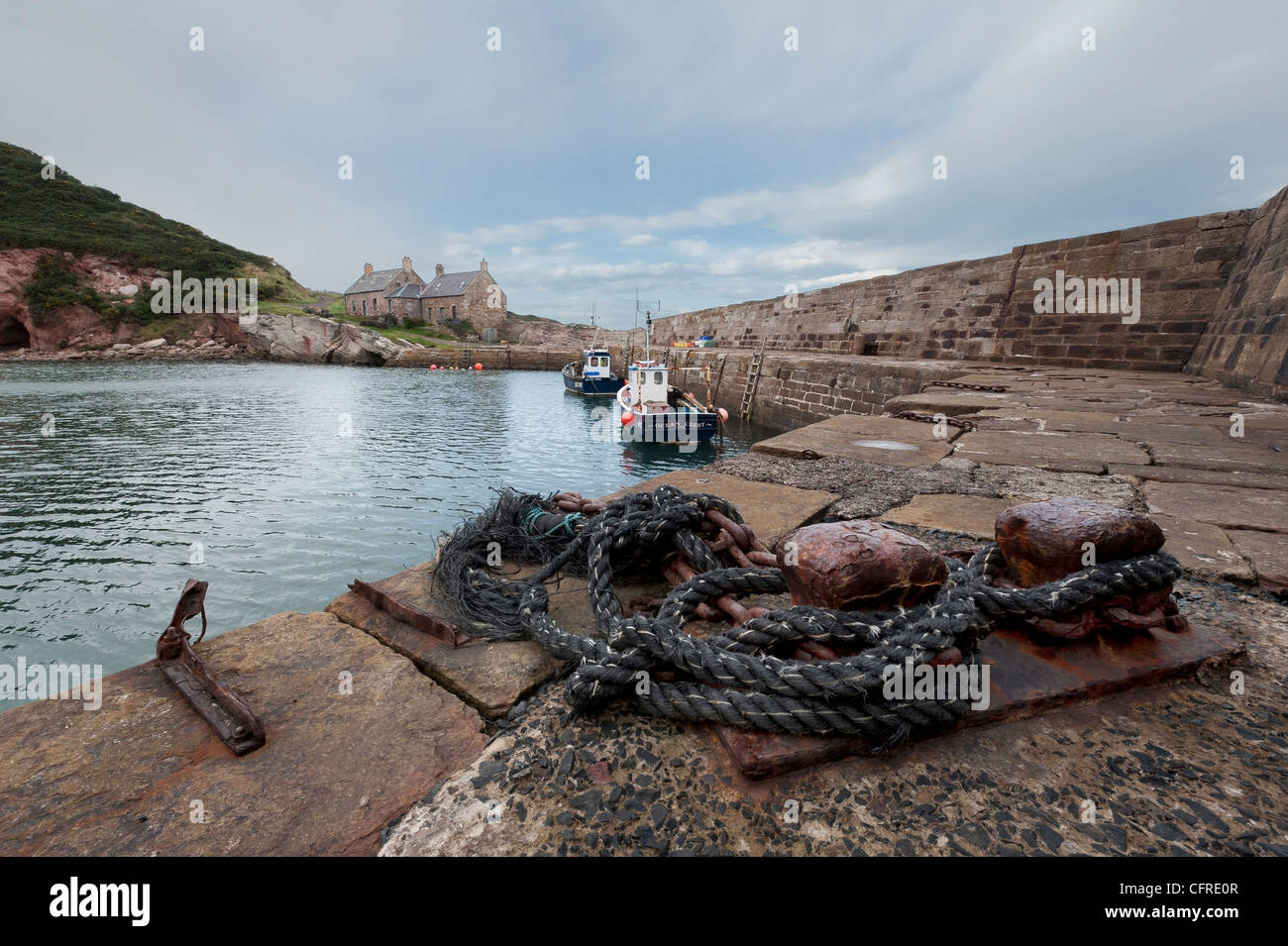 The stone built harbour at Cove, in the Borders, Scotland Stock Photo ...