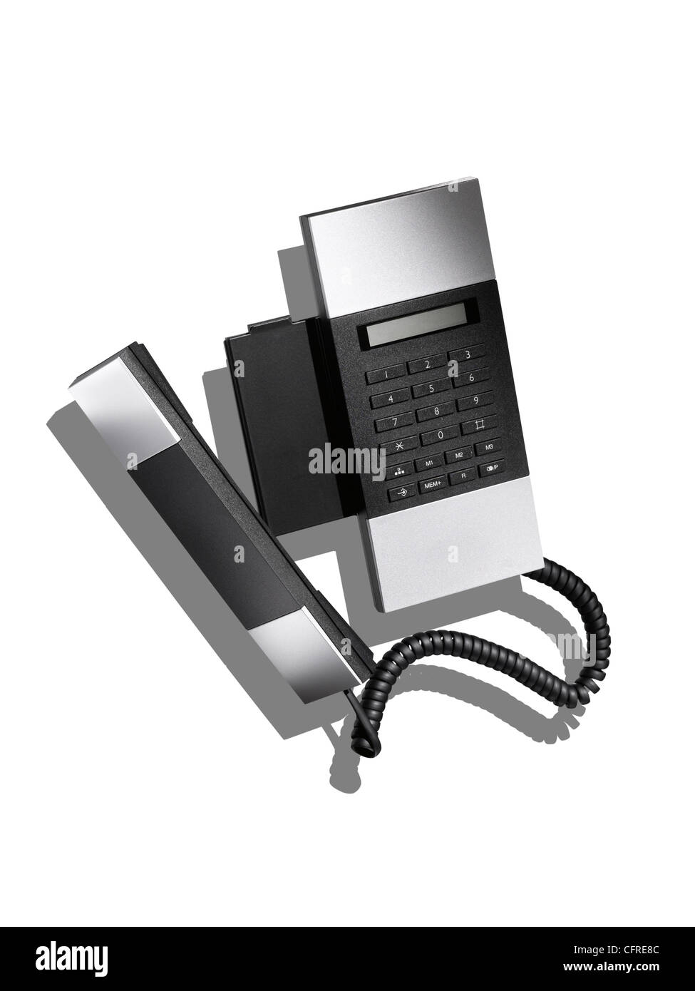 A modern stylish land line telephone on white with creative shadow ...
