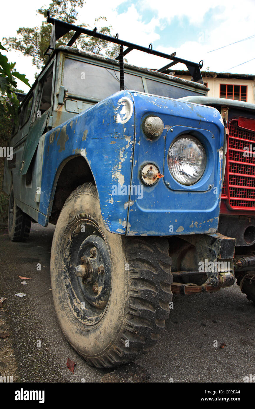 An old four-wheel-drive vehicle by the roadside Stock Photo - Alamy