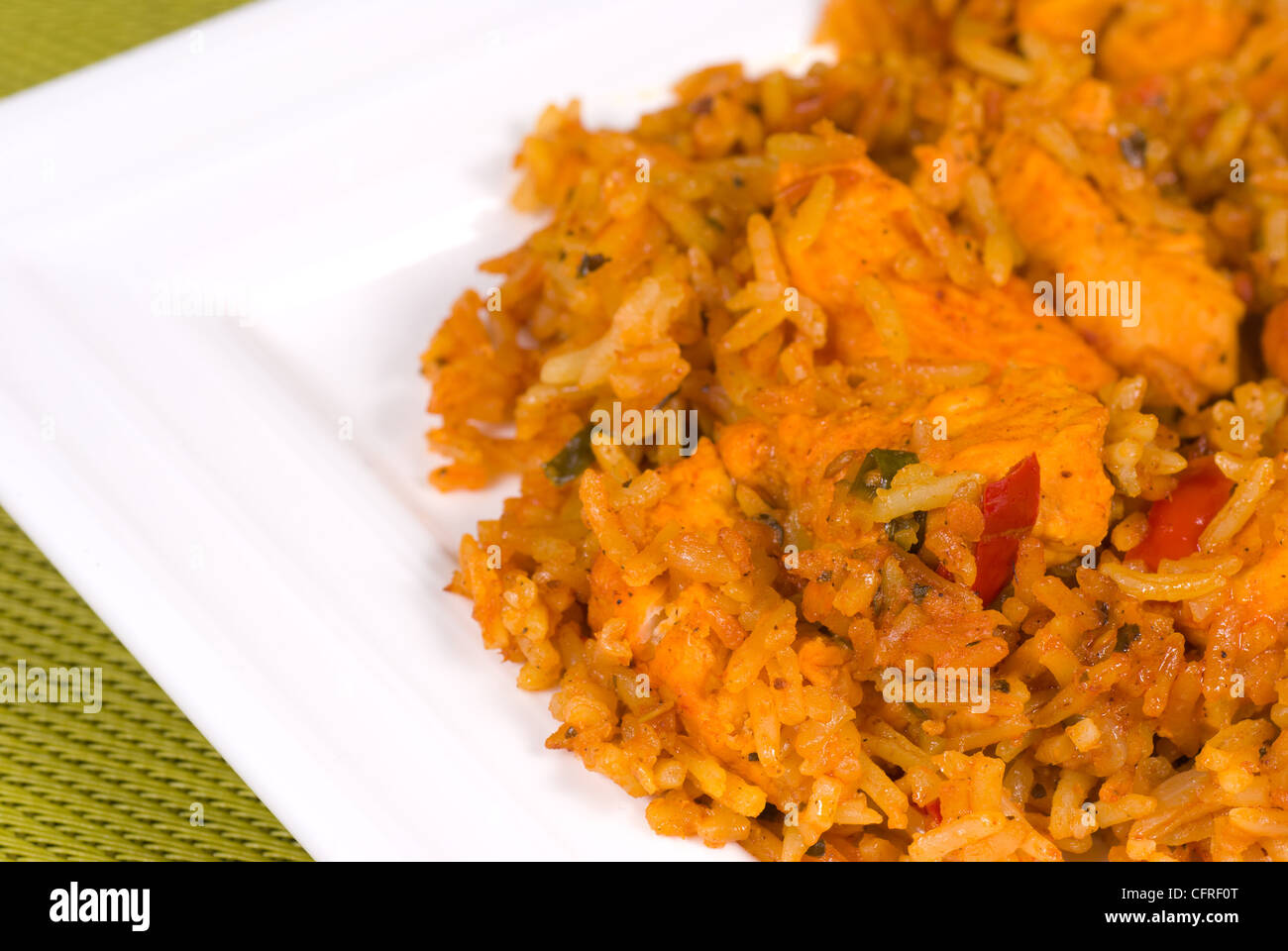 Portion of chicken tika rice, Asian food Stock Photo - Alamy
