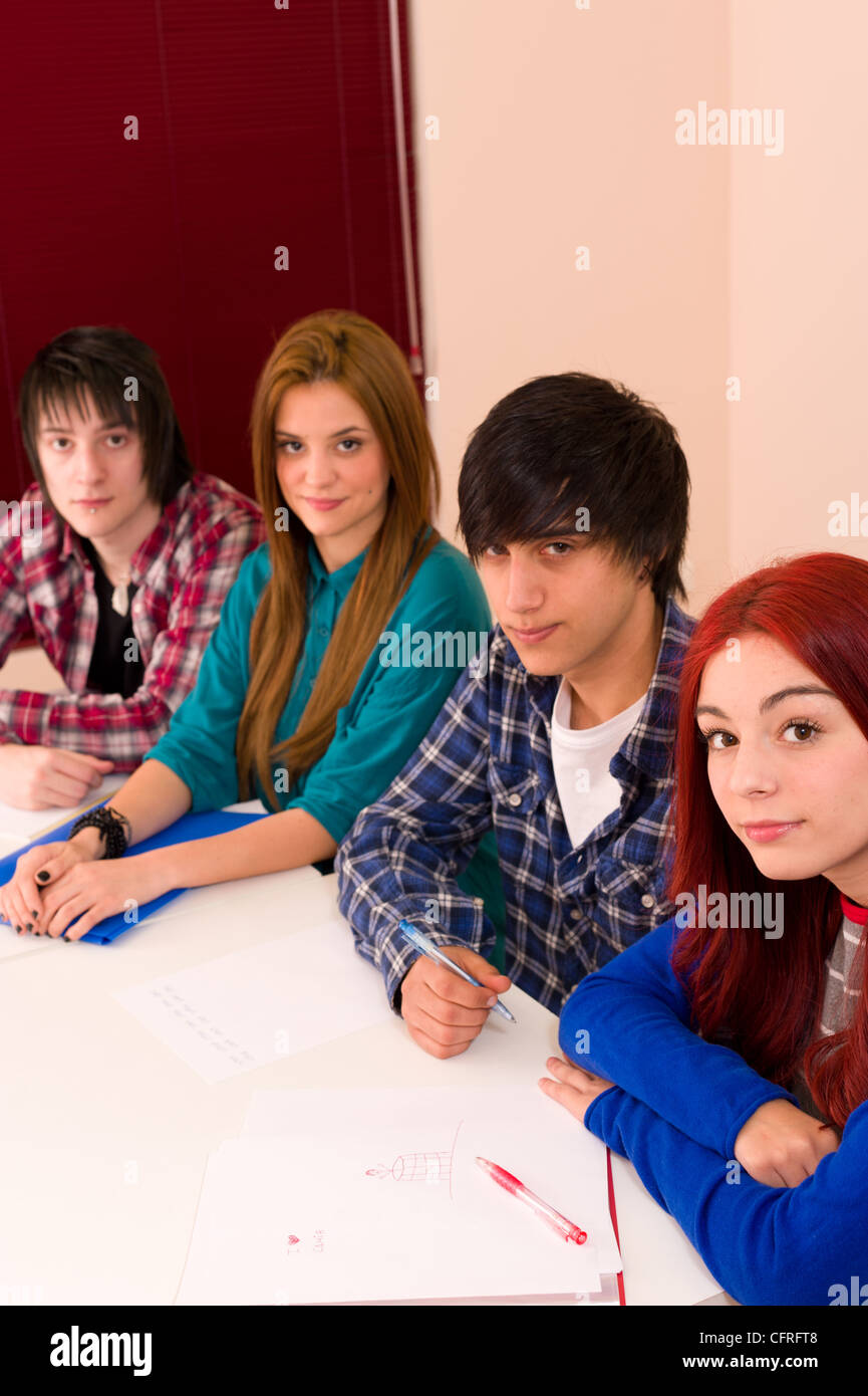 College students sitting at a desk Stock Photo - Alamy