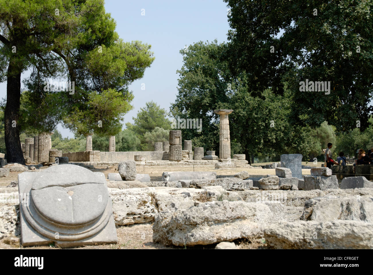 Olympia. Peloponnese. Greece. View across fallen ruins of the temple ...