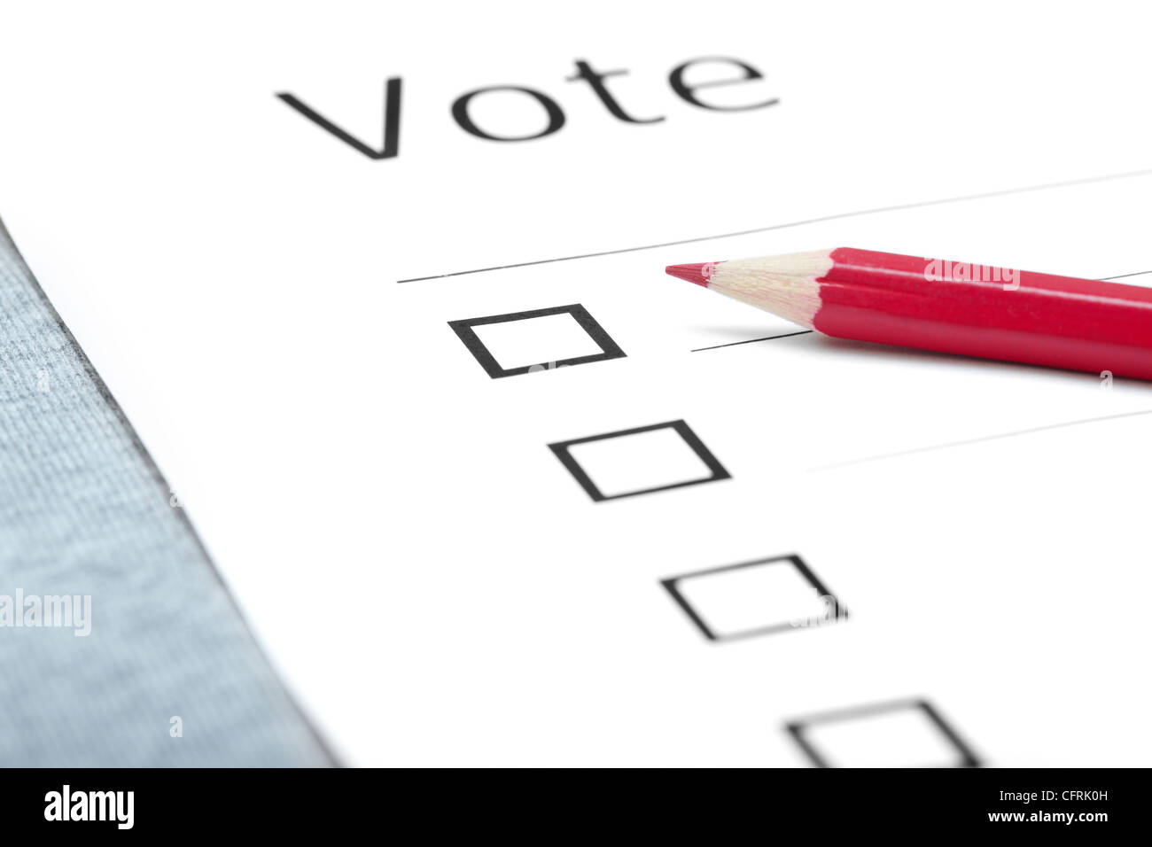 Voting bulletin with red pencil on a table Stock Photo - Alamy