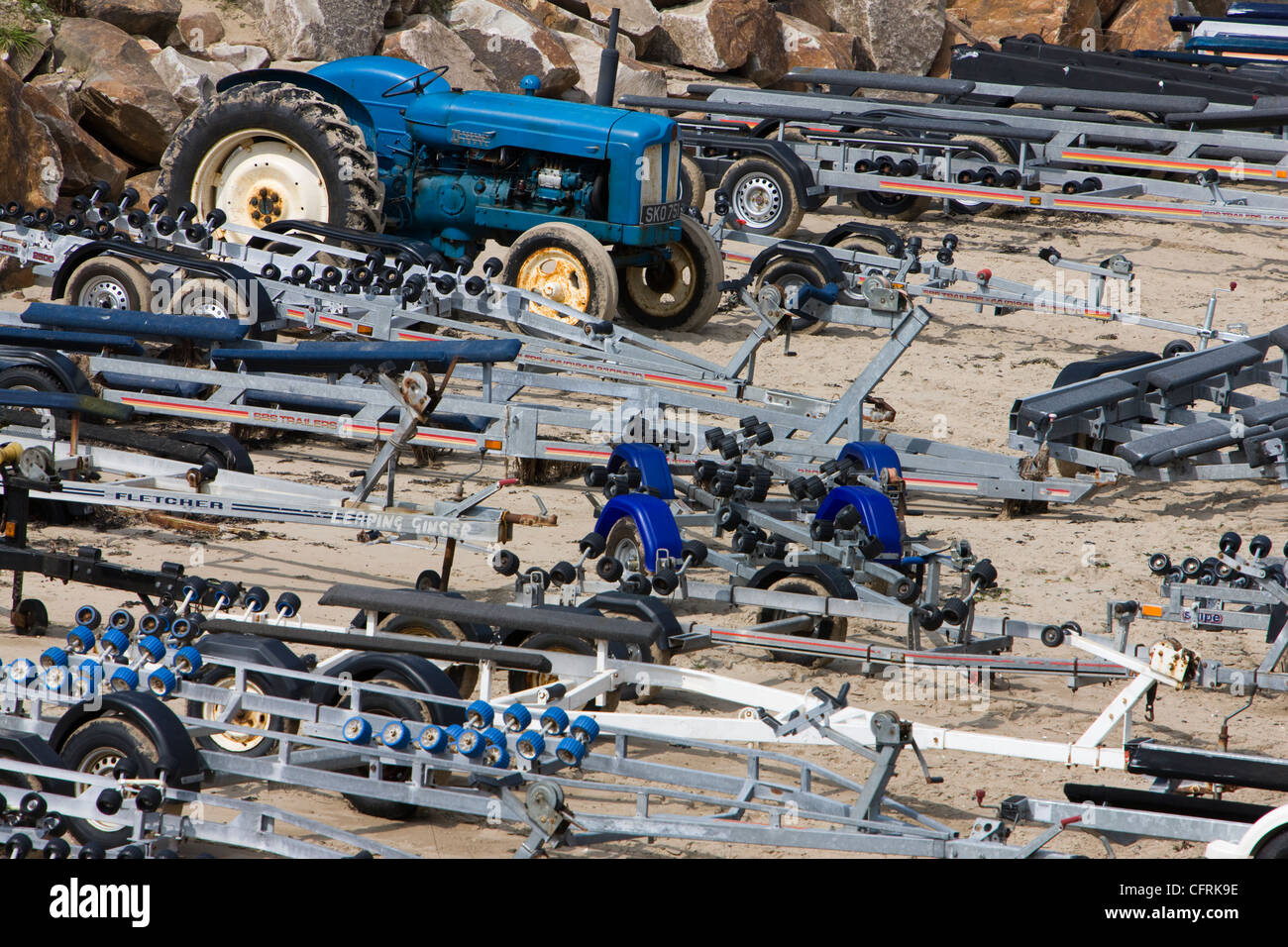Tractors and boat trailers on the beach in Abersoch, Llyn Peninsula ...