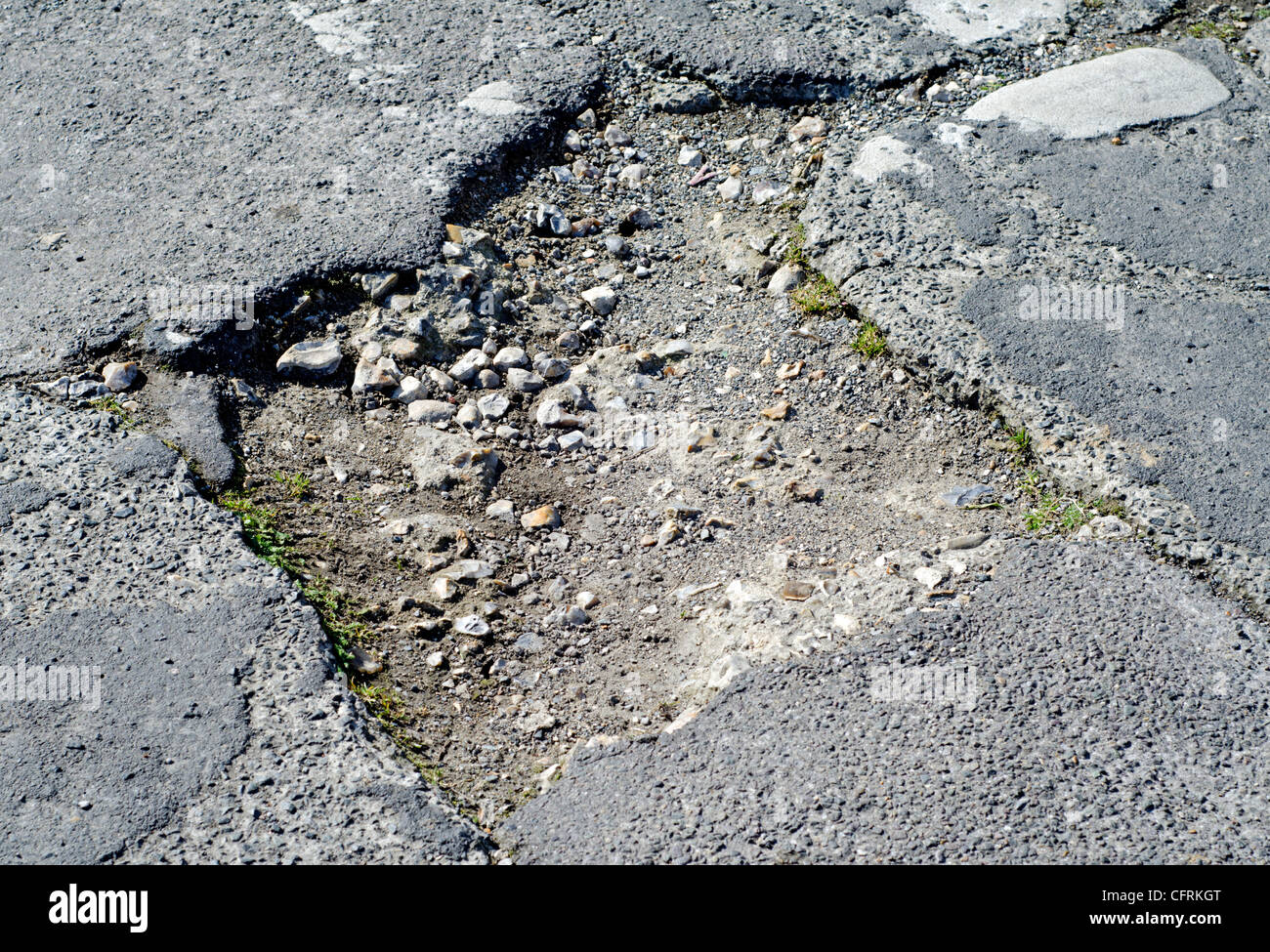 Pothole in a road Stock Photo - Alamy