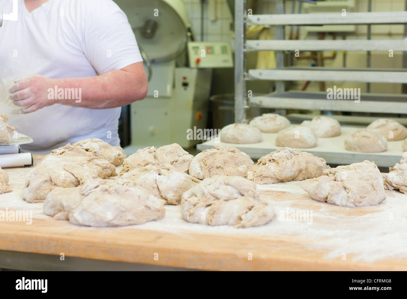 Male baker baking fresh bread in the bakery Stock Photo - Alamy