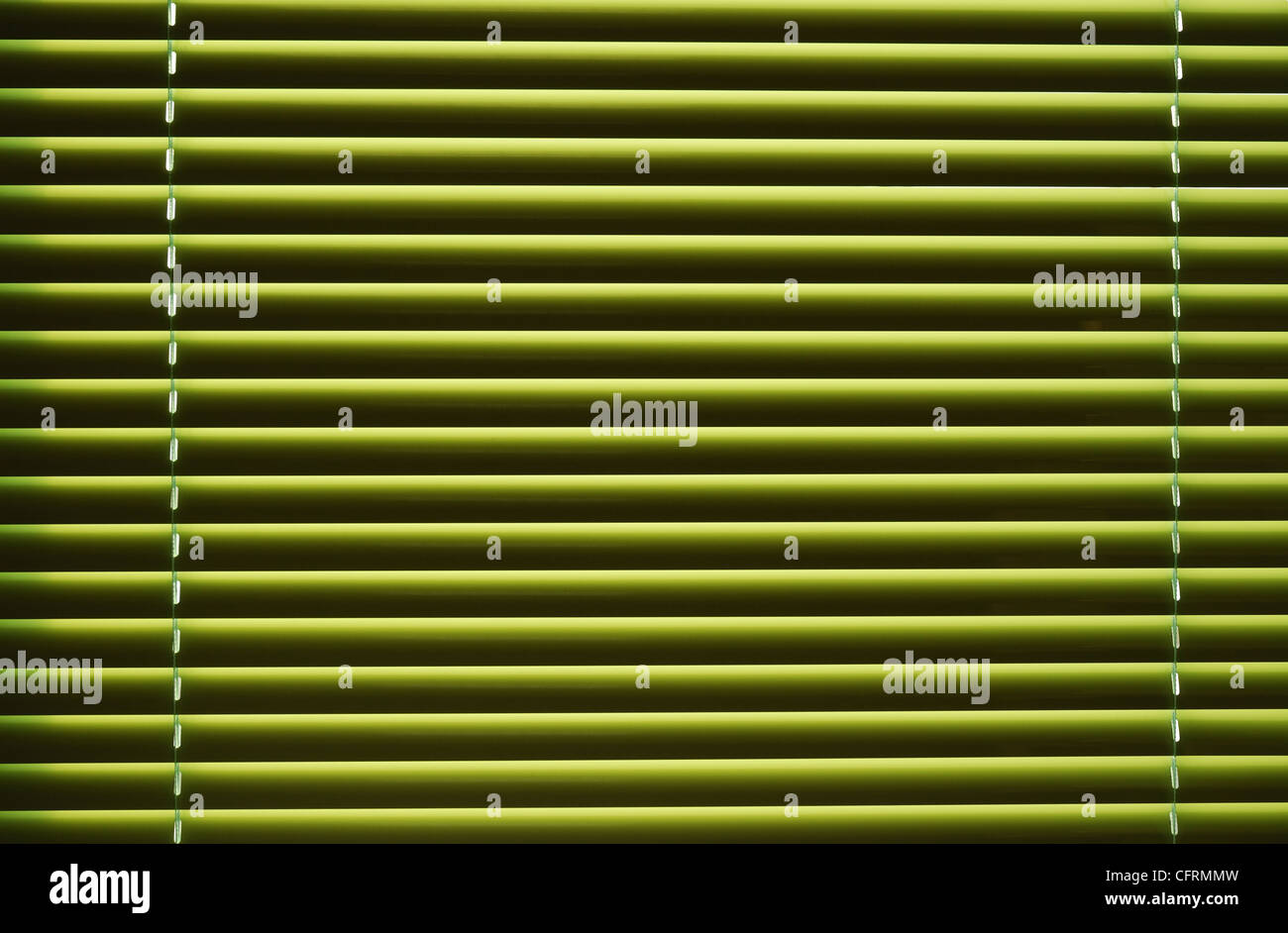 Green jalousie with stripes of light Stock Photo - Alamy