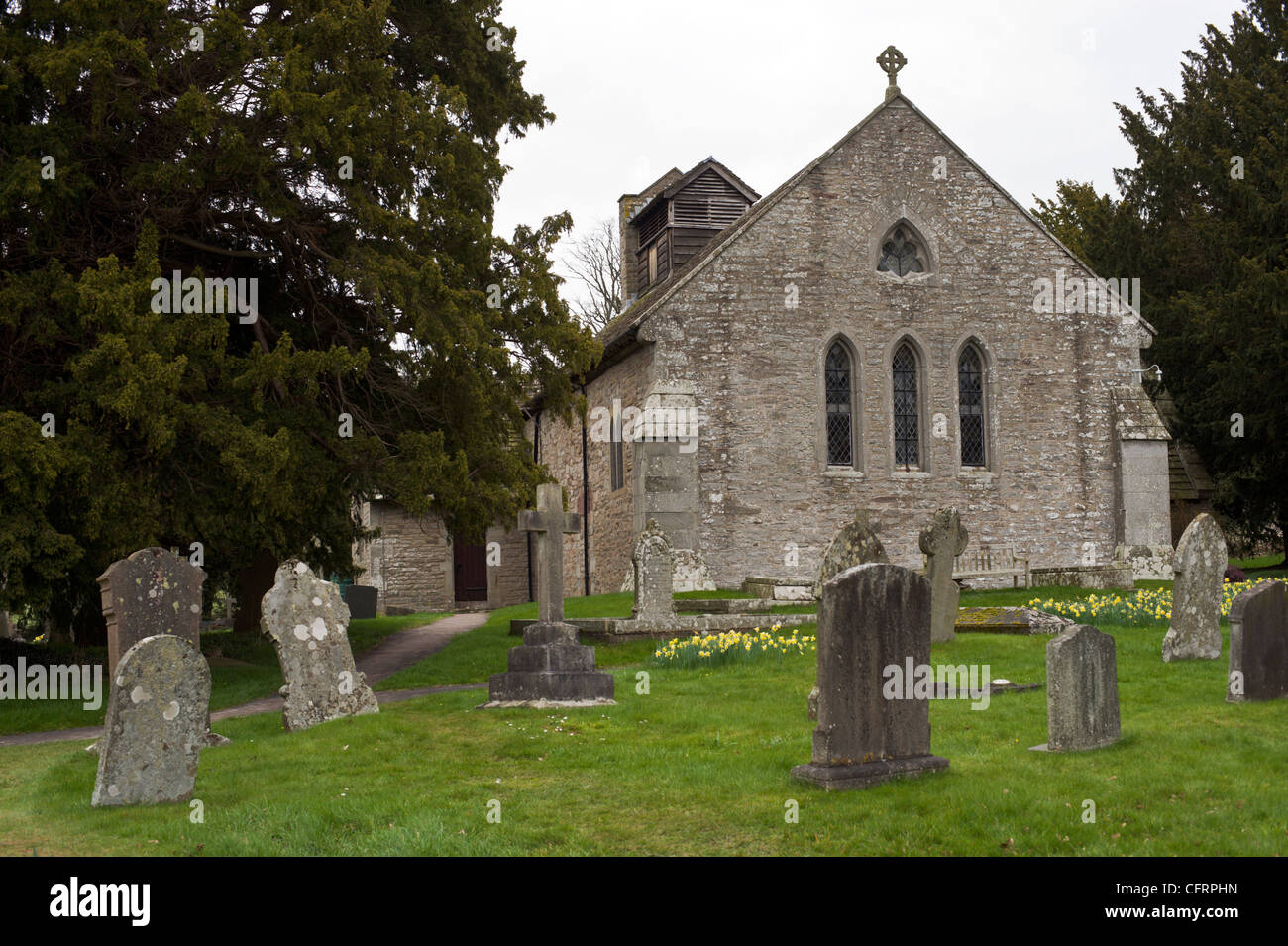 Rural St Mary's Church and graveyard with gravestones at Cusop ...