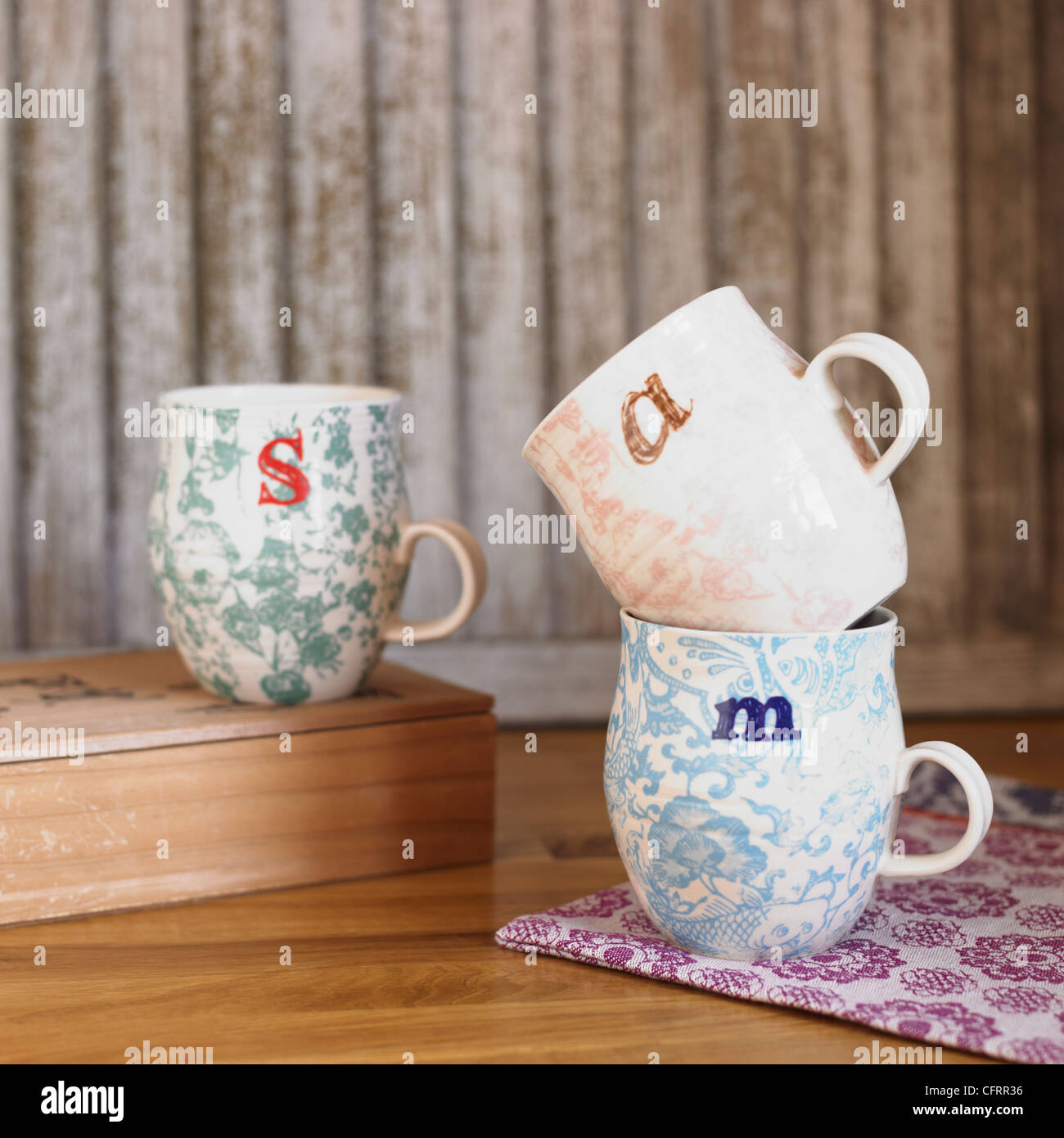 Letter mugs still life Stock Photo - Alamy