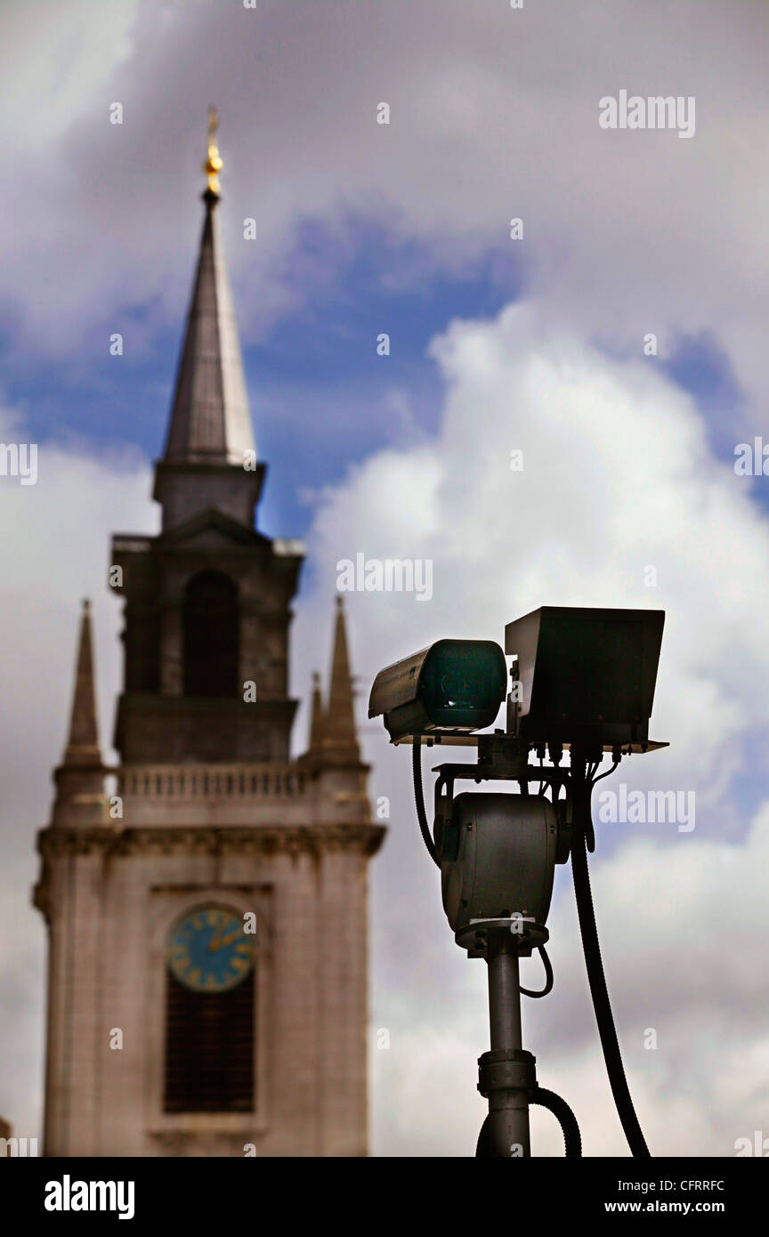 CCTV surveillance camera next to church spire Stock Photo - Alamy