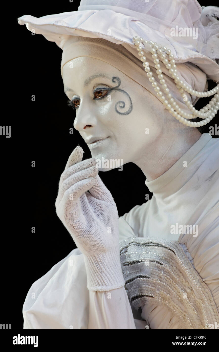 Female mime performing on street corner, Monteriggioni, Italy, Tuscany ...