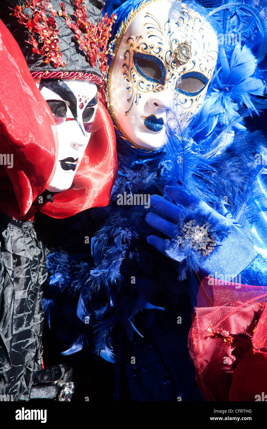People dressed up in blue and red carnival costume for the Carnival of ...