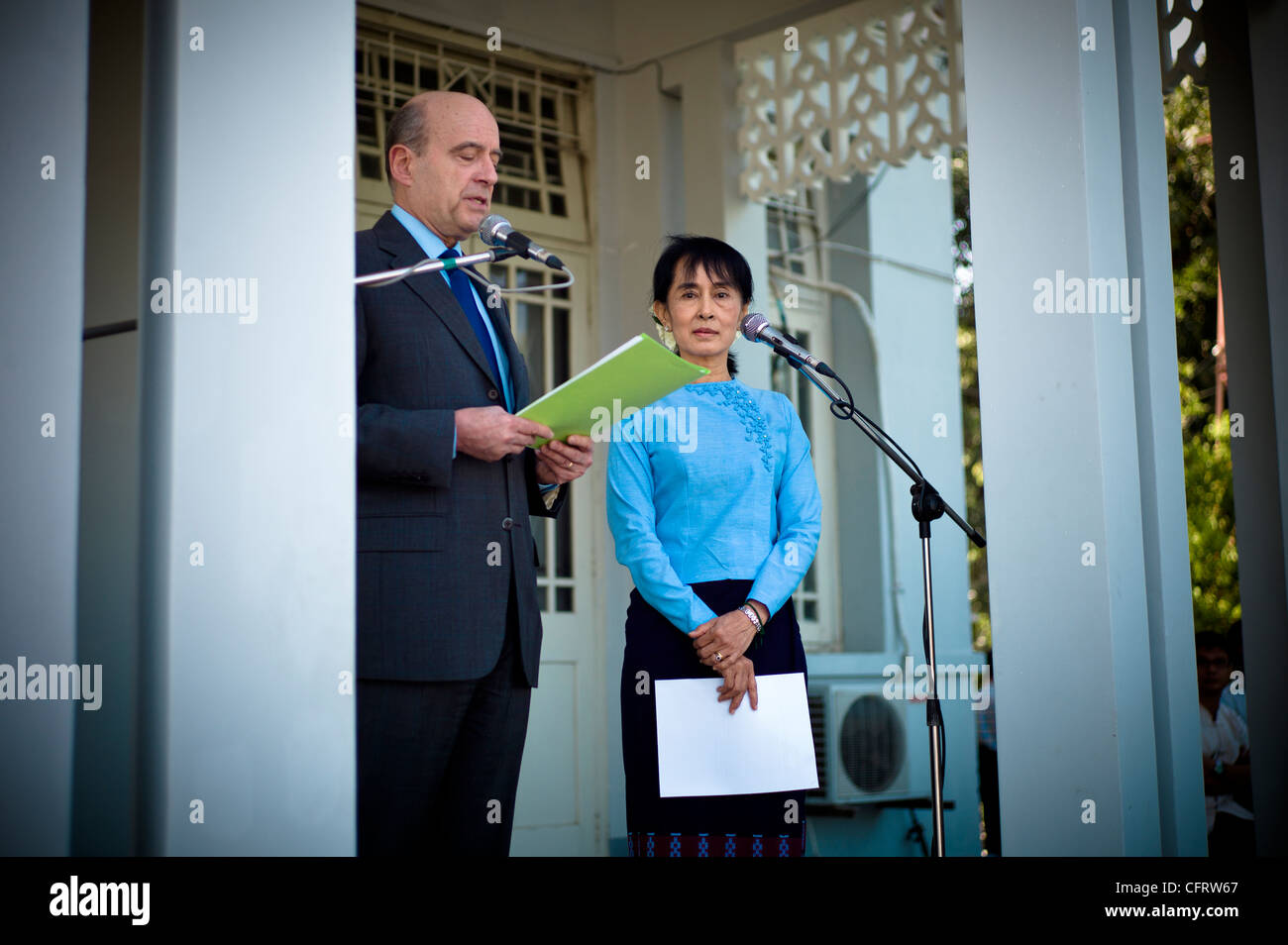 Aung San Suu Kyi with French Foreign Minister, Alain Juppe, at a press ...