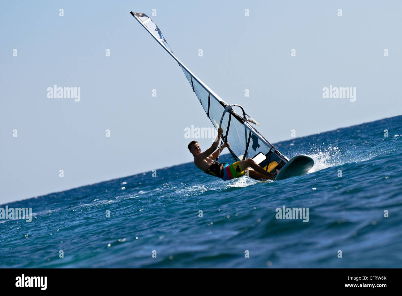 Front view of a windsurfer passing by almost horizontally Stock Photo ...