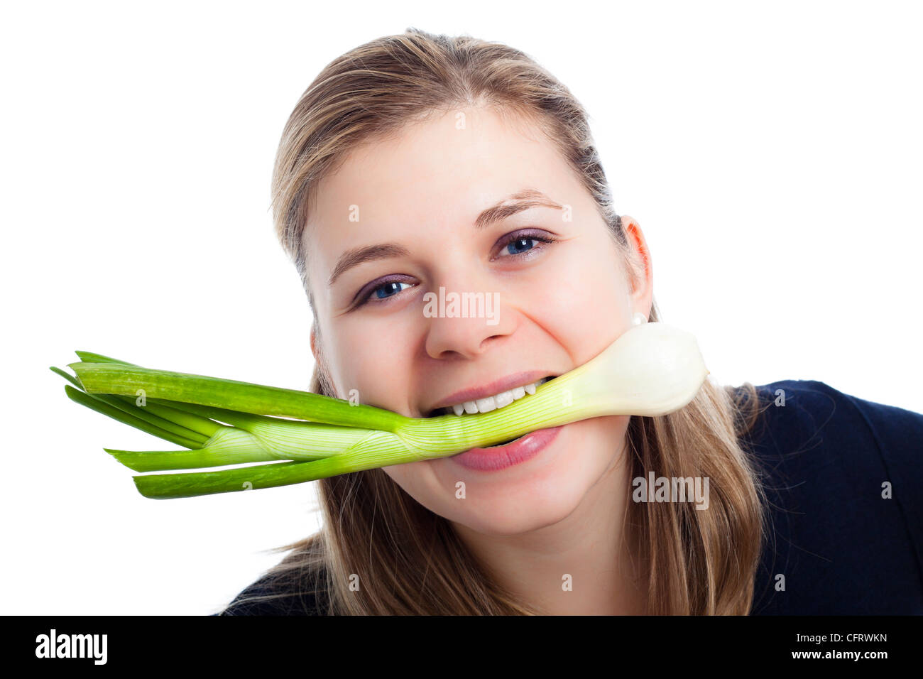 Beautiful young happy funny woman with fresh spring onion, isolated on ...