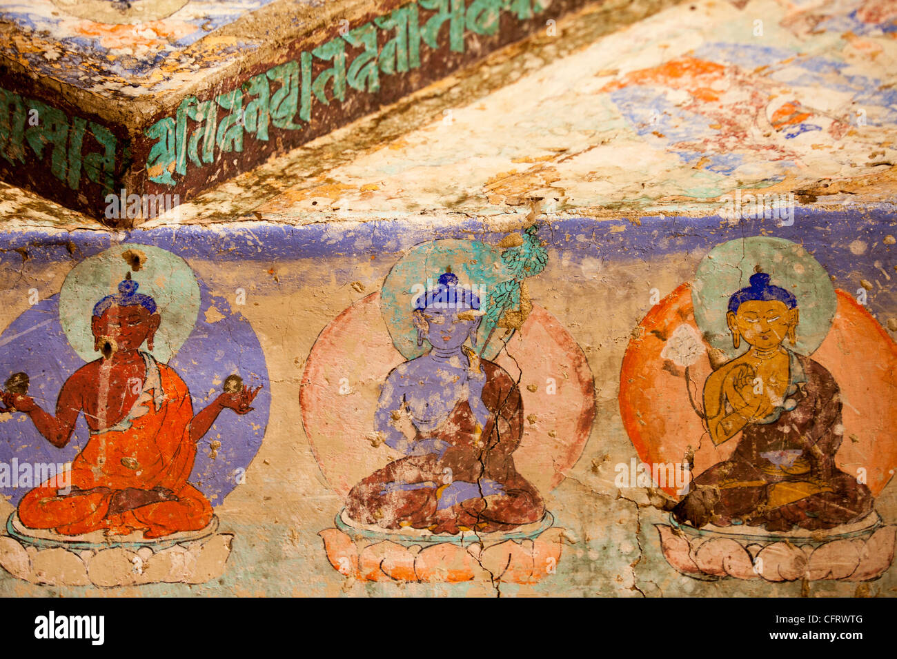 Aged Buddhist murals adorning the walls of a small temple at the Stok ...