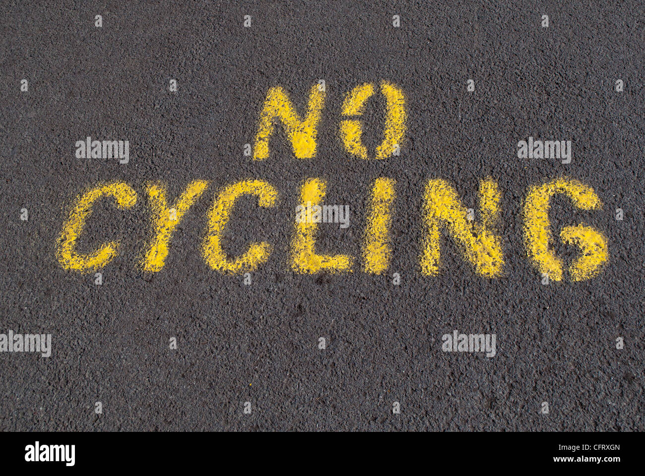 No Cycling sign painted on pavement on Hampstead Heath, London, UK ...