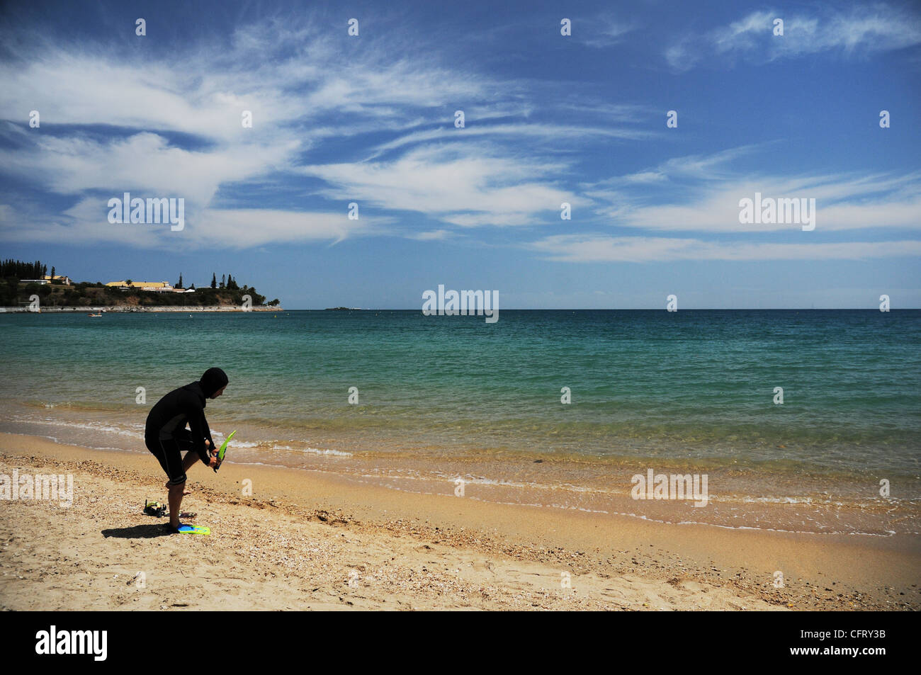 Swimmer getting ready to enter the sea Stock Photo - Alamy