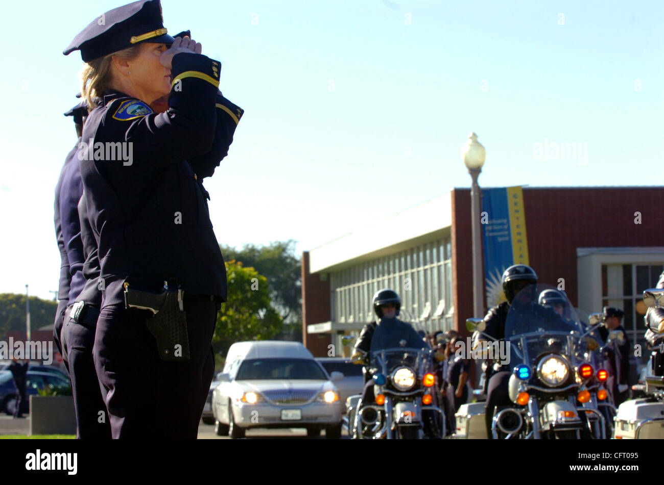 Richmond police officer Lori Ritter salutes as a hearse carrying Kaliah ...