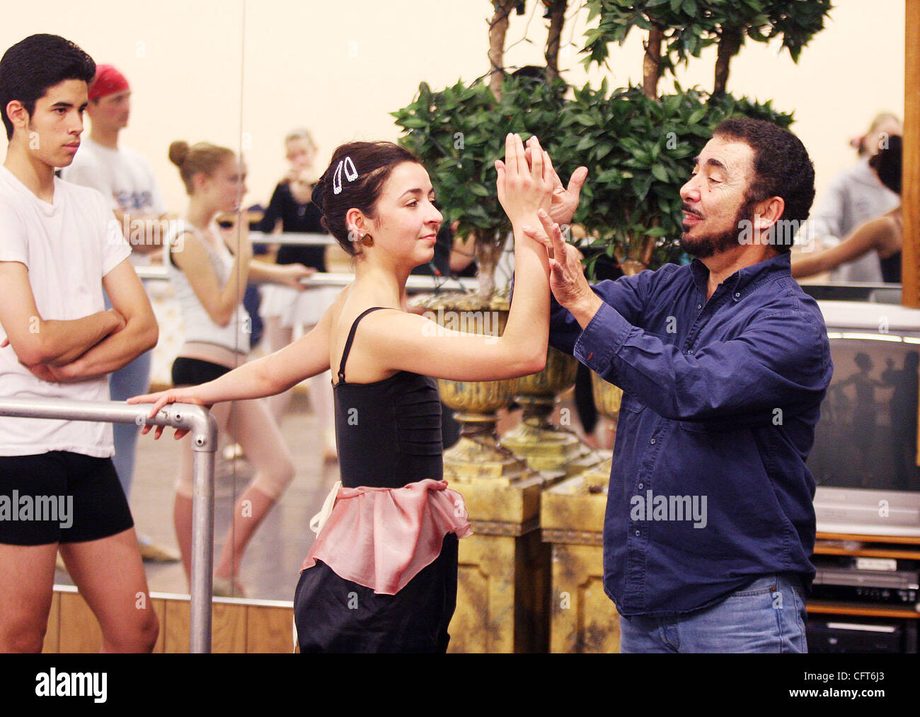 Oakland Ballet founder Ronn Guidi, right, perfects the position of ...