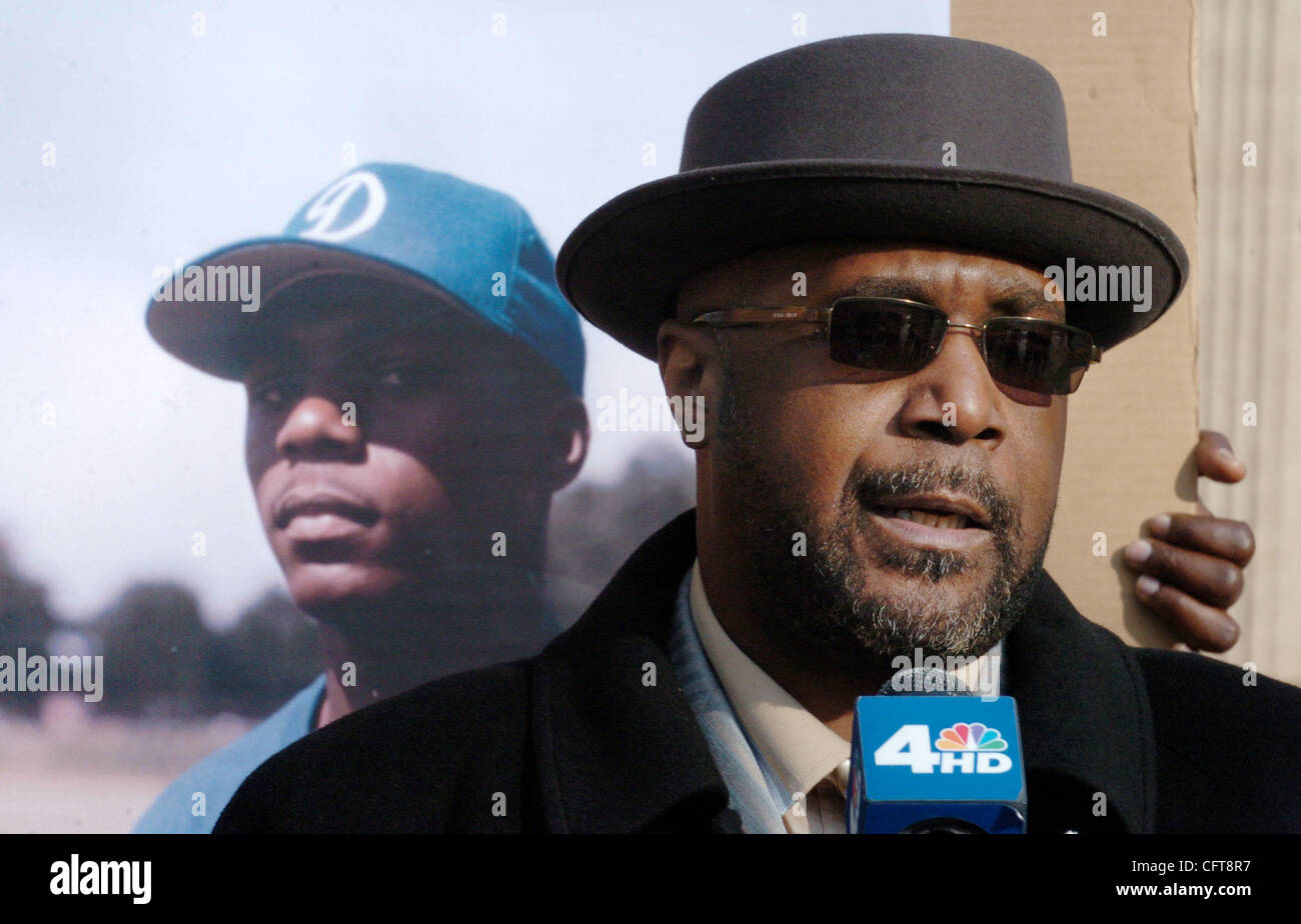 William Bell, the father of Sean Bell, speaks with a photo of Sean Bell ...