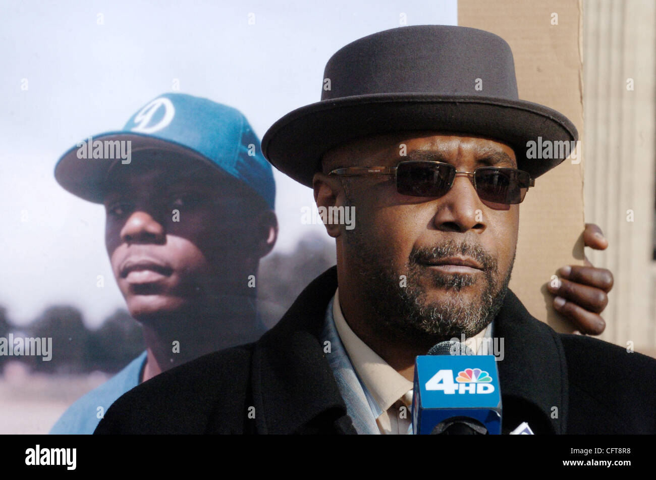 William Bell, the father of Sean Bell, speaks with a photo of Sean Bell ...