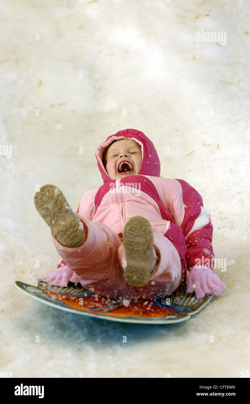 Kaylin Johnson, 3, slides down the hill at city park, where the city ...