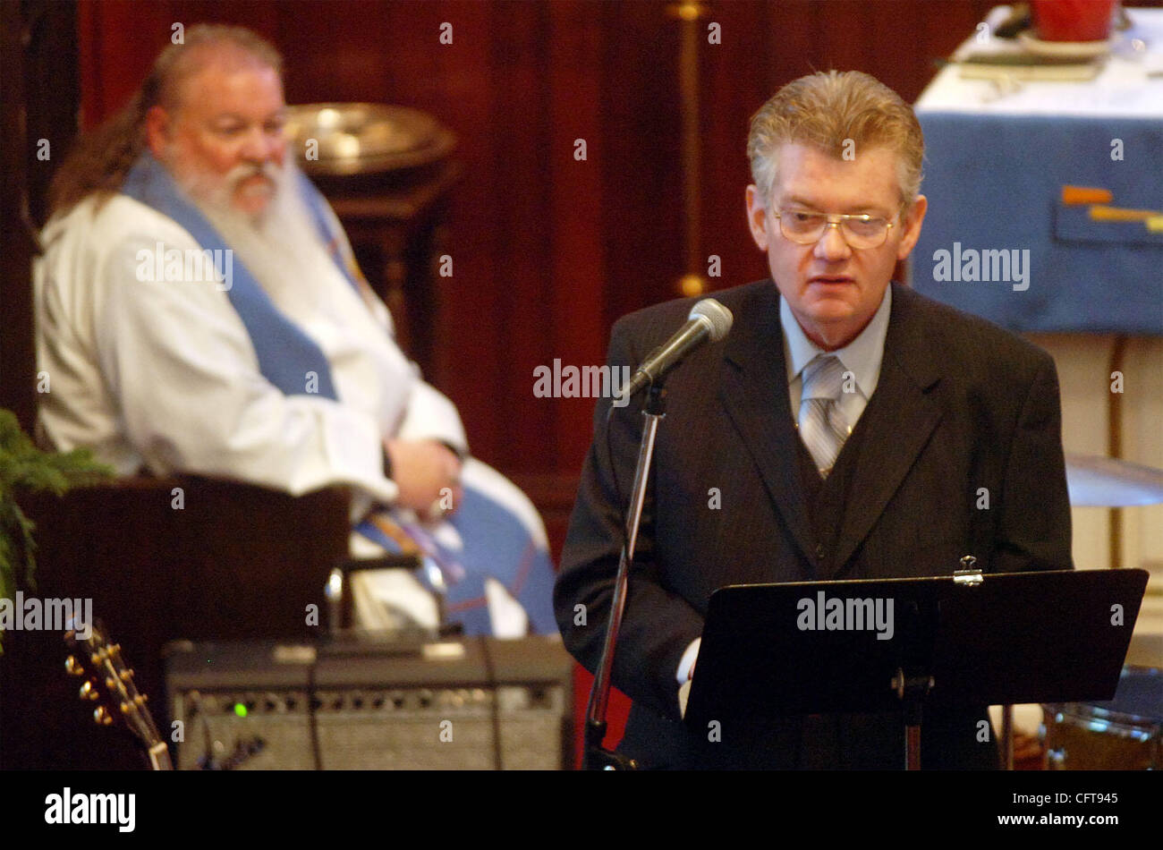 Brian Black, the son of Dave Black, talks to guests during a memorial ...