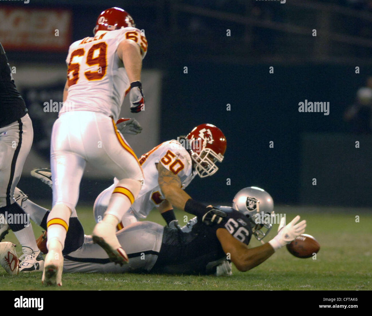 Kansas City Chiefs (L-R) Kawika Mitchell (#50) covers Oakland Raider ...