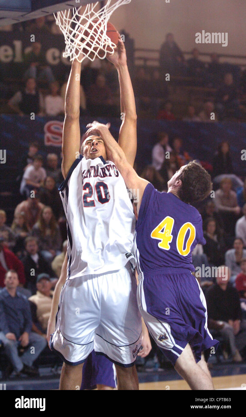 St. Mary's forward Diamon Simpson (20) makes the shot while being ...