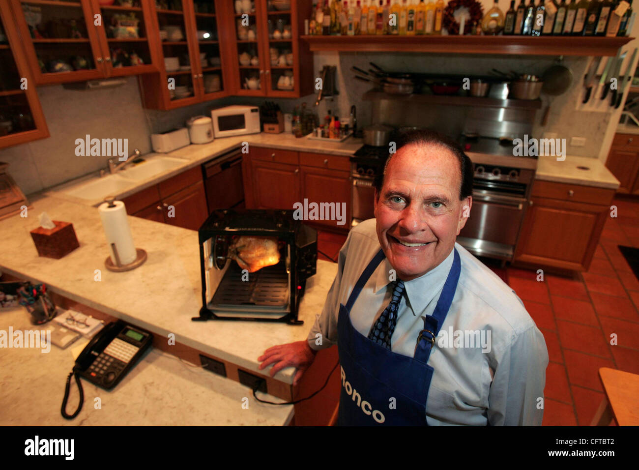 Ron Popiel, inventor and infomercial marketer, poses at his kitchen in ...