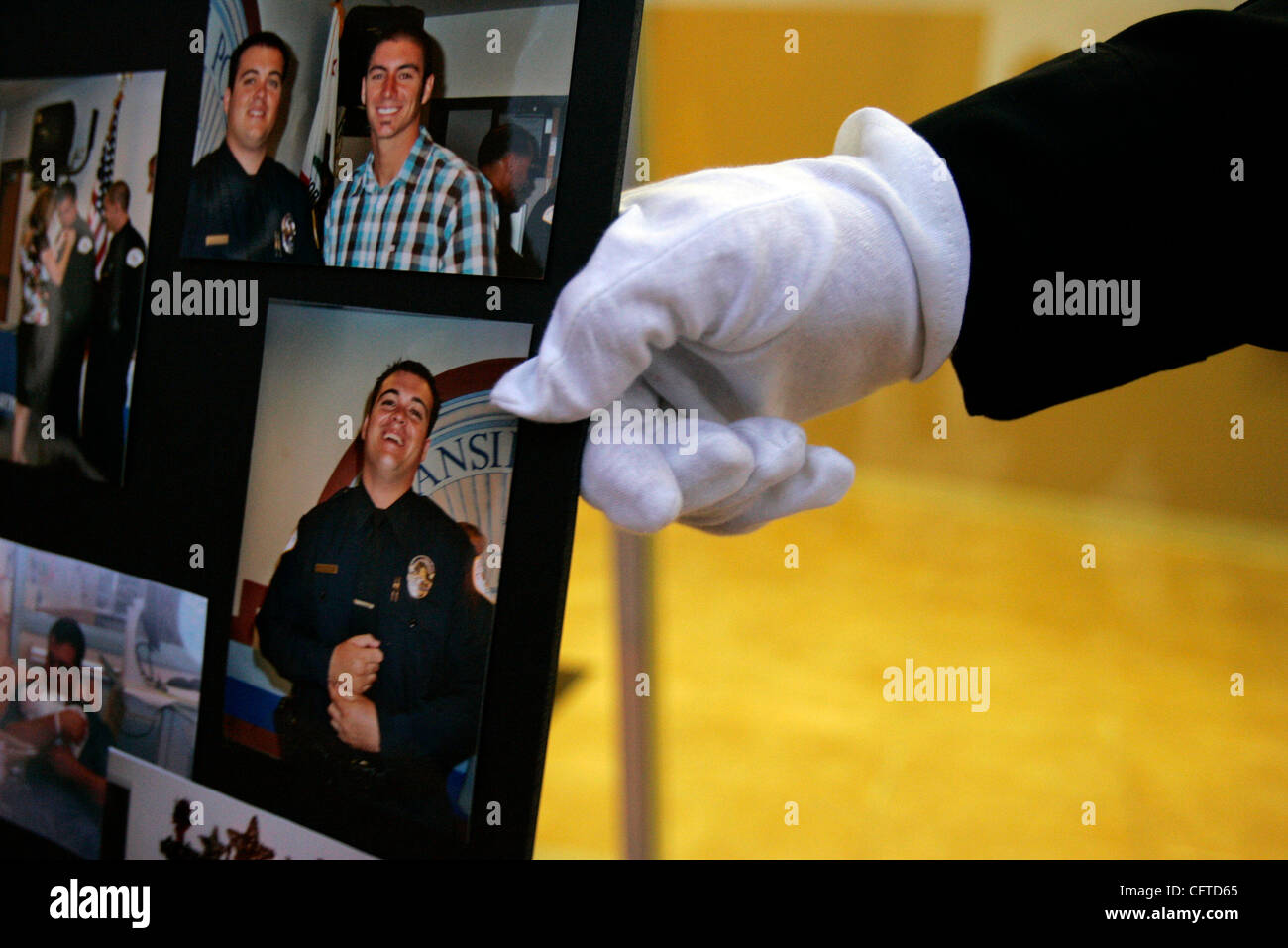 Oceanside Police Lt. Joseph Young holds a board displaying photographs ...