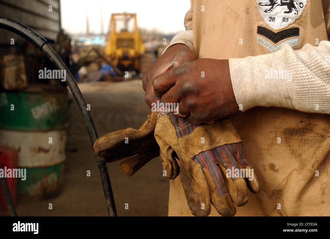 Vincent Clemons pulls on his gloves for the second day on the job at W ...