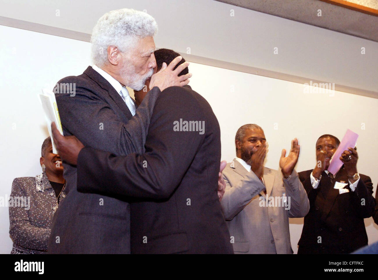 City of Oakland Mayor Ron Dellums kisses Keith Carson of the ...