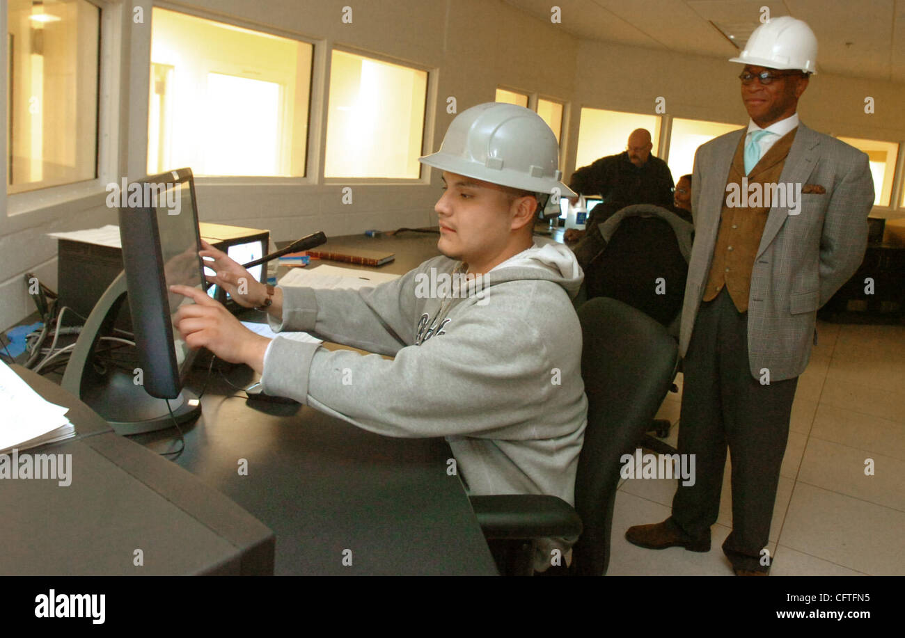 Ramiro Barajas 19, of Oakland, Calif., (left) operates the touch screen ...