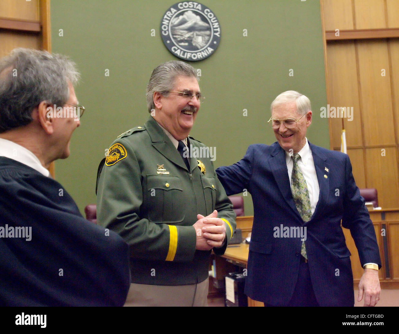 Contra Costa County Sheriff Warren Rupf (center) is congratulated by ...