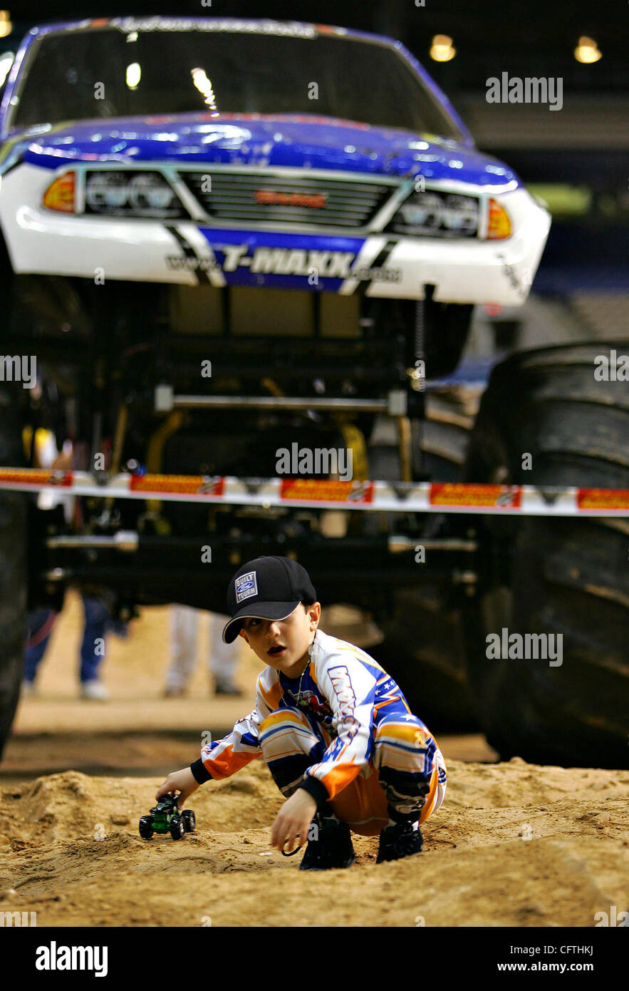 METRO - Johnny Garza plays with a toy truck at the Monster Jam Saturday ...