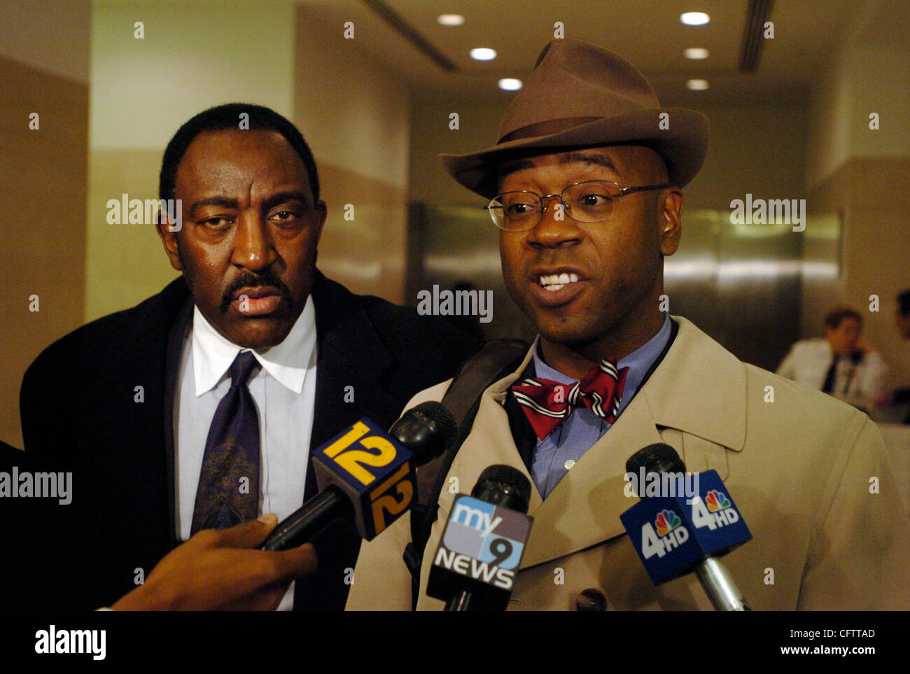 Clarence Norman, Jr., charged with attempted grand larceny, looks on as ...