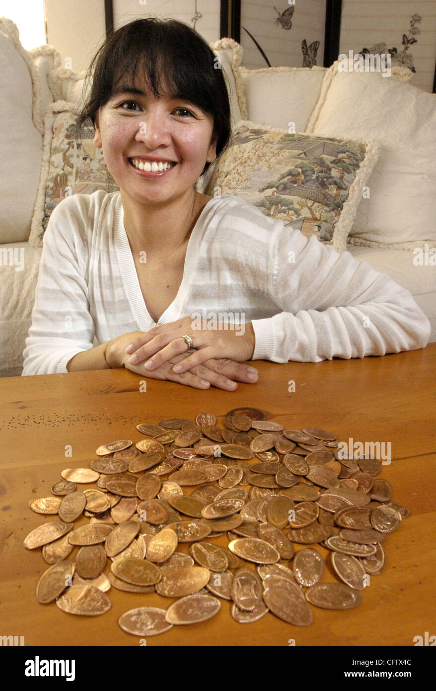 Catherine de Leon poses for a photo with some of her squished penny ...