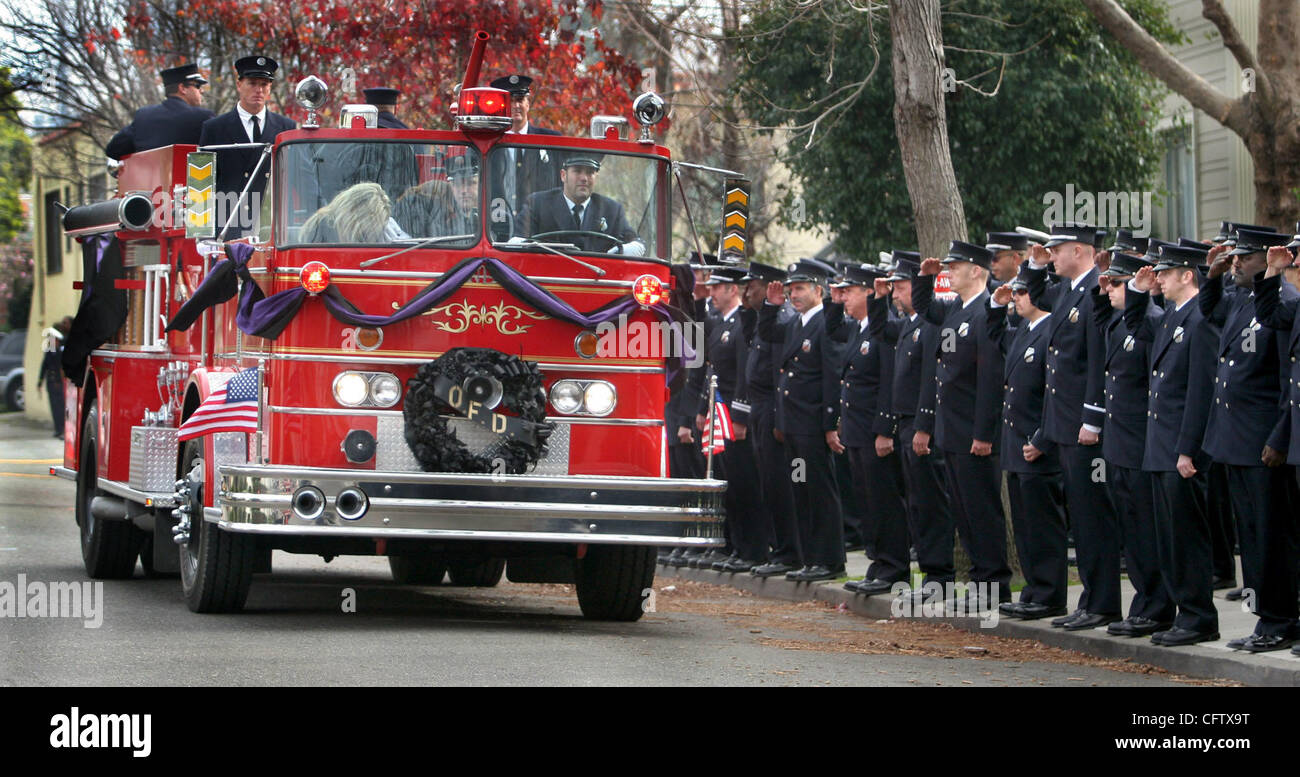 Firefighters from several cities salute during the arrival of late ...
