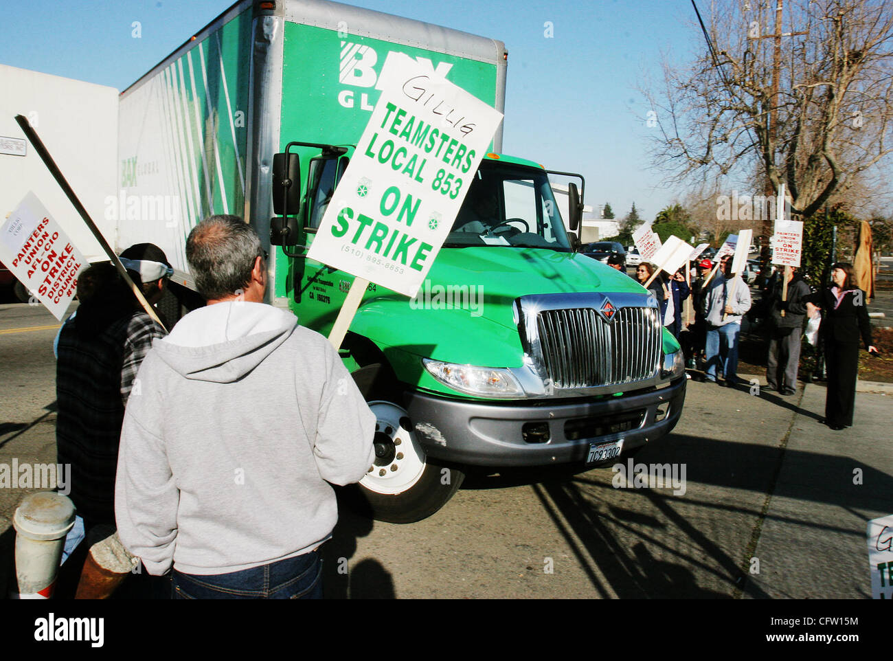 Members of Teamsters Local 853 at Gillig Bus Company try to dissuade a ...