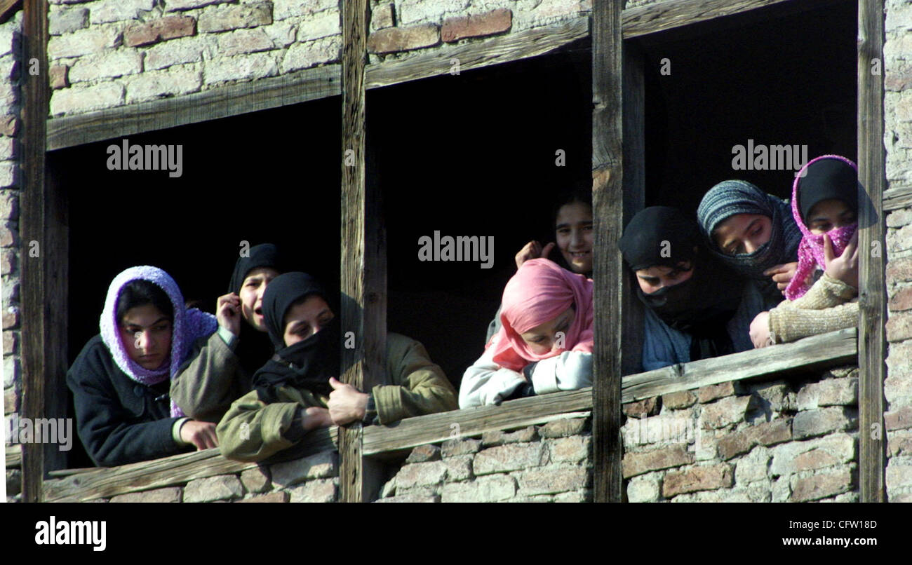 Women watch Kashmiri Shiite Muslim perfoming the ritual of "Tatbir" by ...