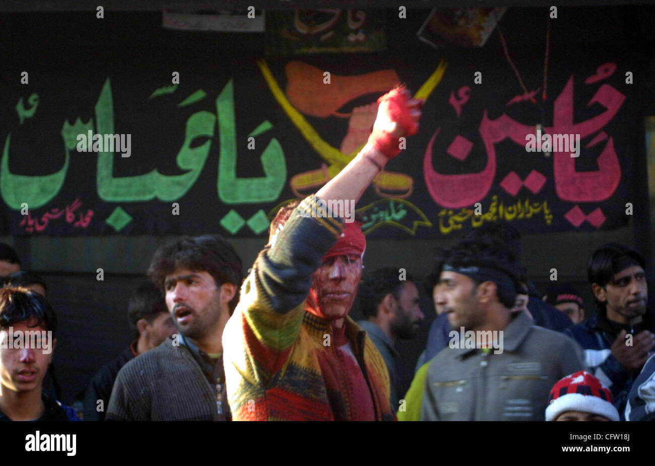 Kashmiri Shiite Muslim perfoming the ritual of "Tatbir" by slicing his ...